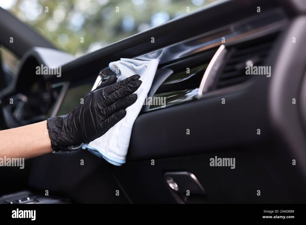 Woman wiping her modern car with rag, closeup Stock Photo - Alamy