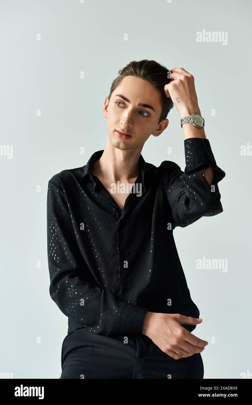 A young man, proudly representing the LGBTQ+ community, poses ...