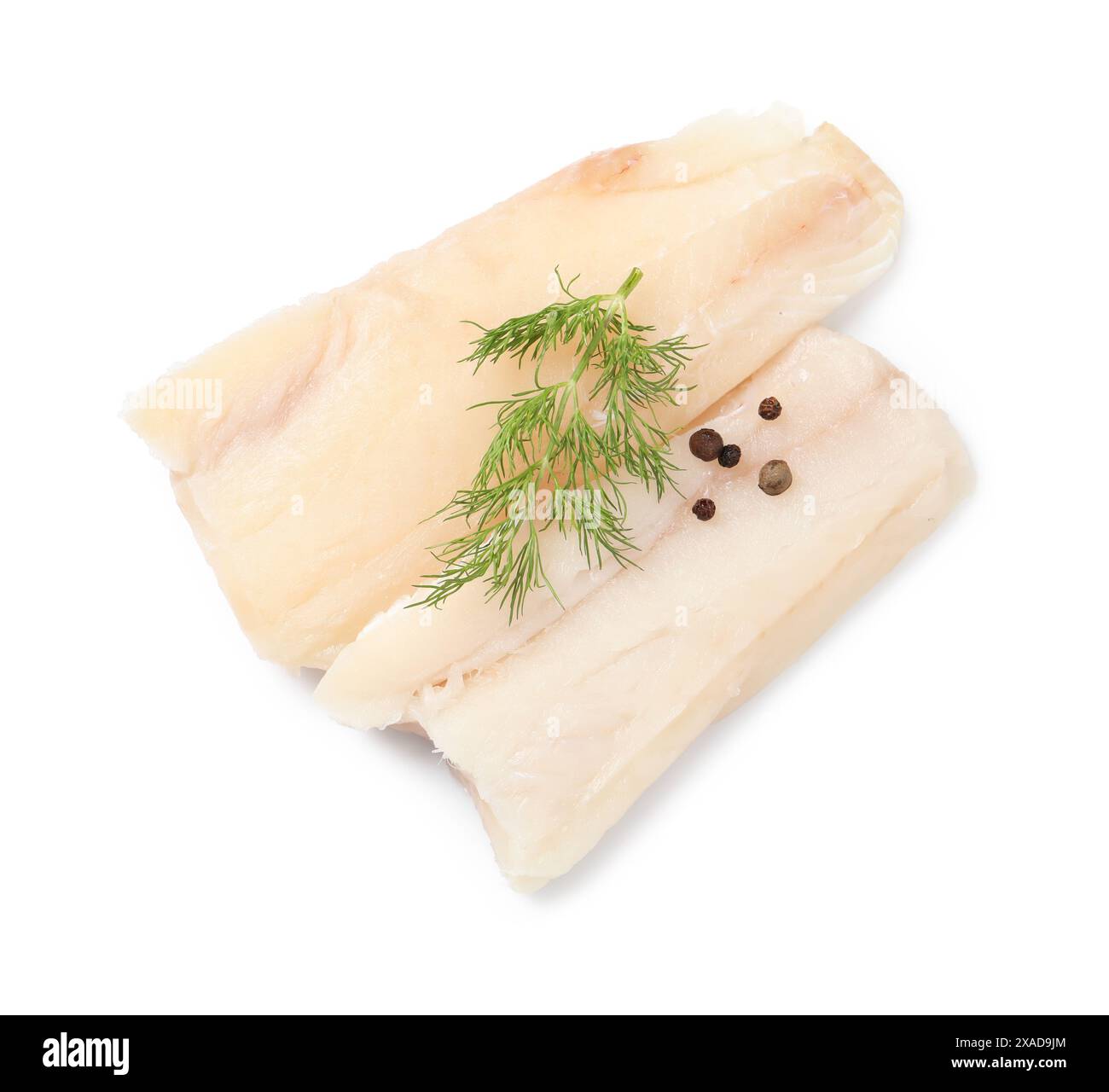 Pieces of raw cod fish, dill and peppercorns isolated on white, top ...
