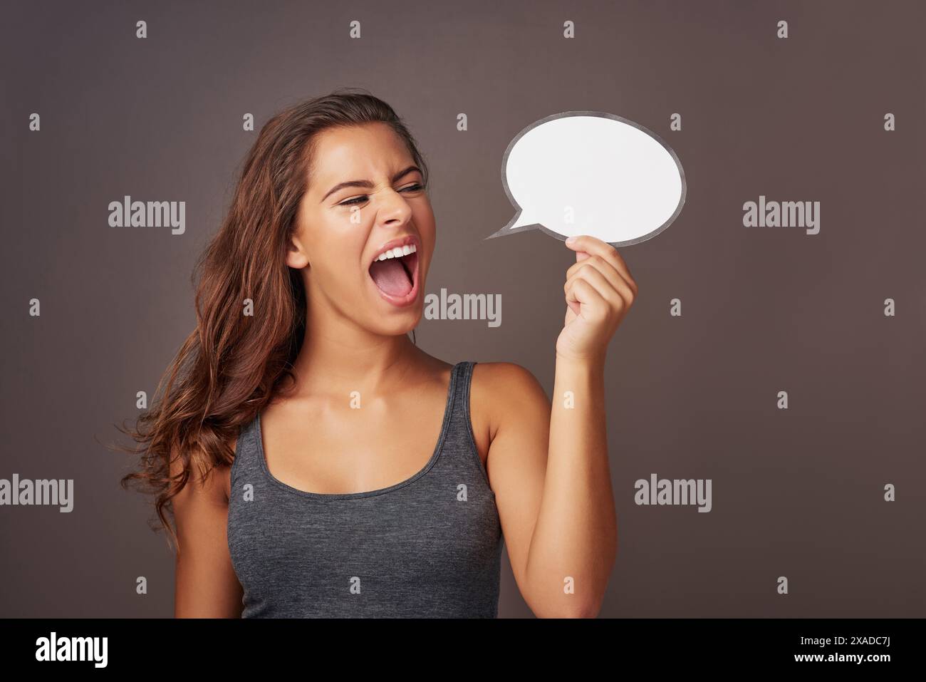 Woman, speech bubble and shout in studio background for product ...