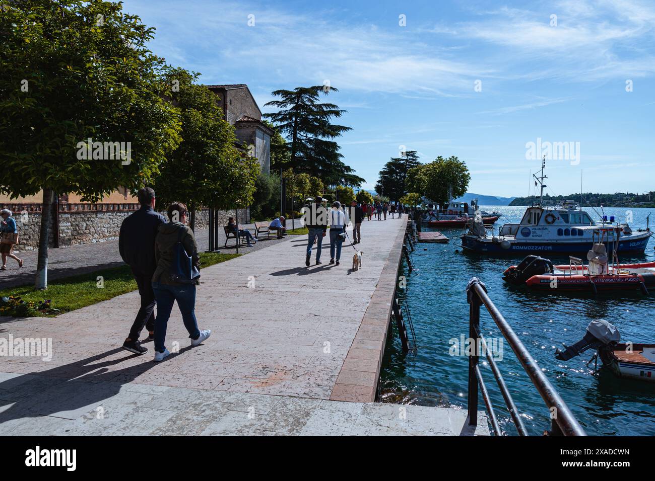 Lake garda, mountains and the town of Salò during a beautiful spring ...