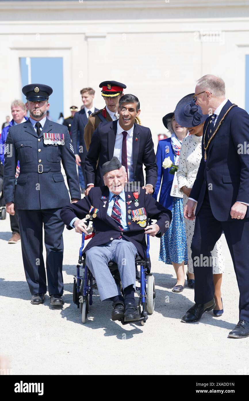 Prime Minister Rishi Sunak wheels a D-Day veteran Bernard Morgan, 100 ...