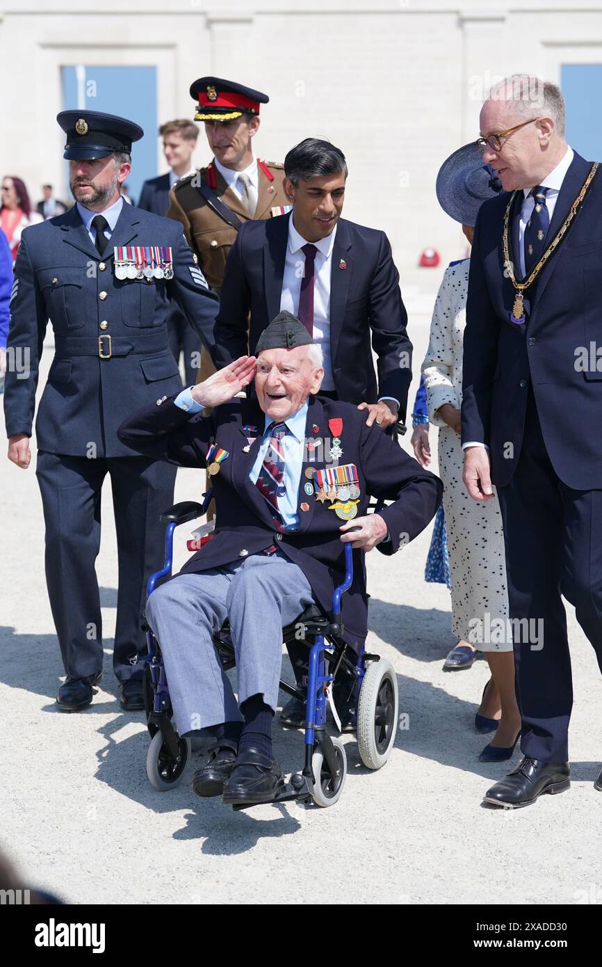 Prime Minister Rishi Sunak wheels a D-Day veteran Bernard Morgan, 100 ...