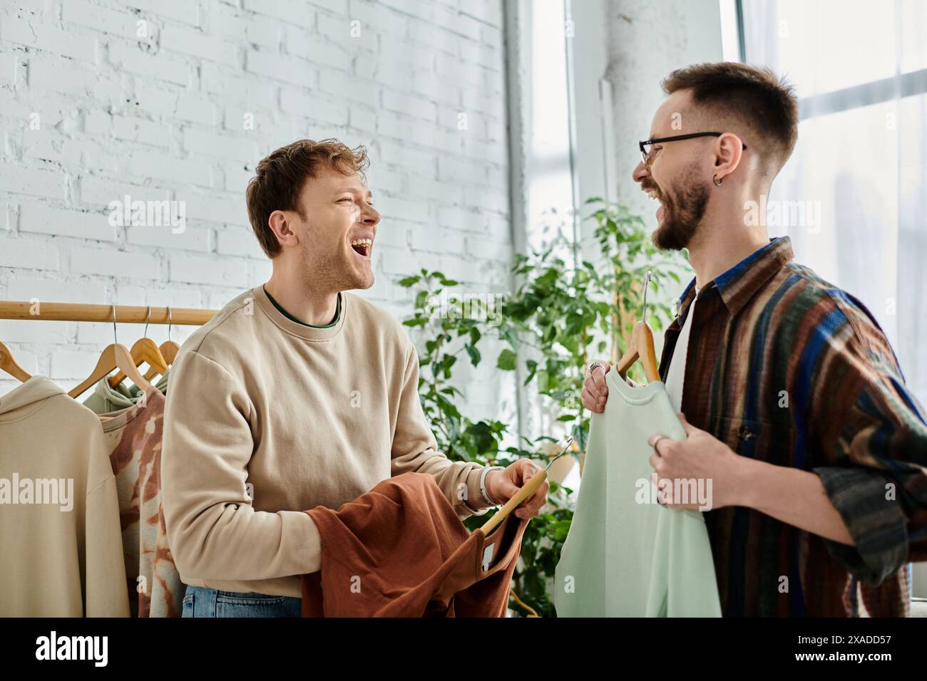 Two stylish men share a moment of unity while collaborating on original ...