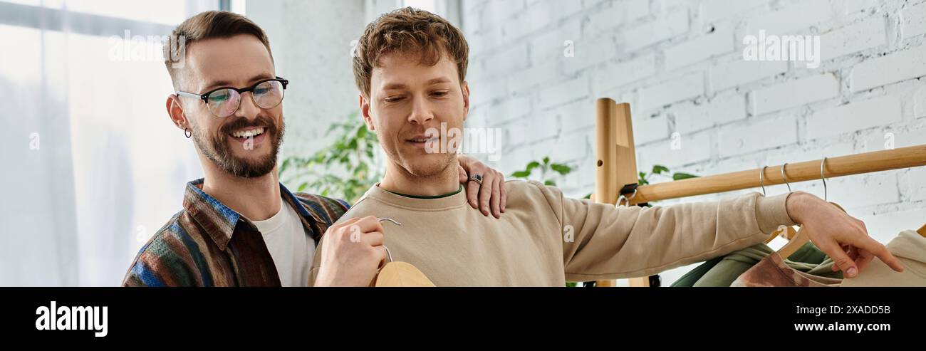 Two men, a gay couple, collaborate on designing stylish clothes in a ...