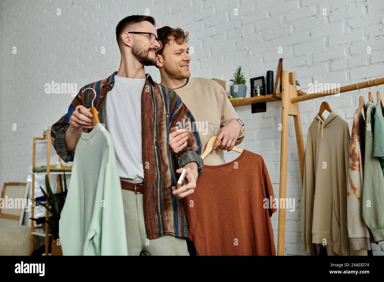 Two men, partners in love, standing in a designer workshop creating ...