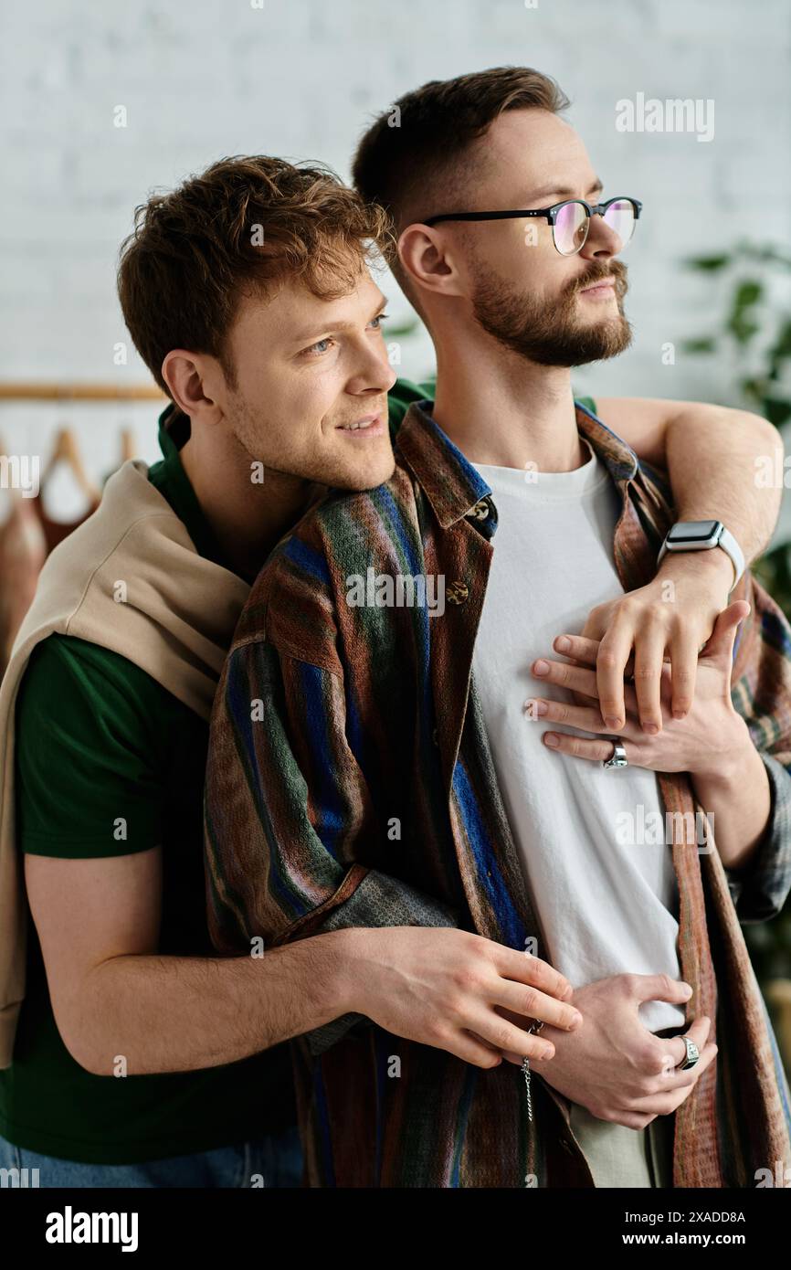 Two men stand together in a designer workshop, passionately crafting ...