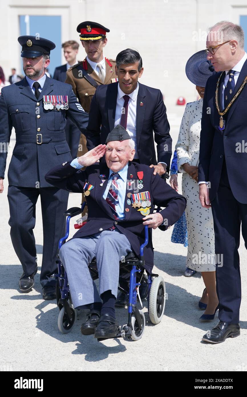 Prime Minister Rishi Sunak wheels a D-Day veteran Bernard Morgan, 100 ...