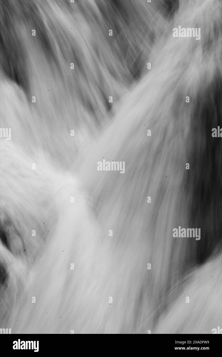 Abstract motion blur of water falling over rock formations at Great ...