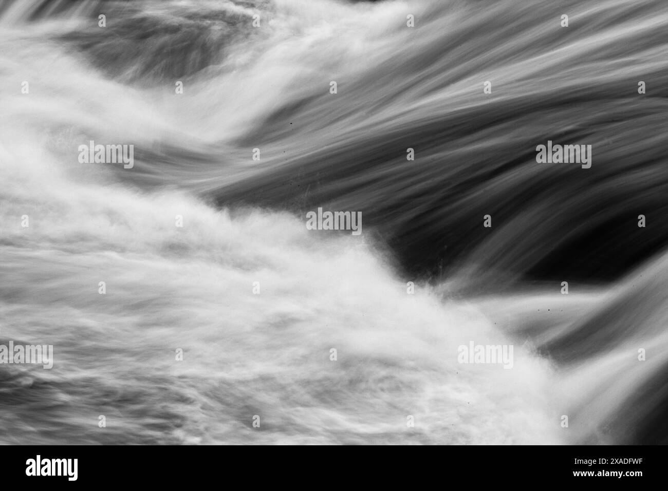 Abstract motion blur of water falling over rock formations at Great ...