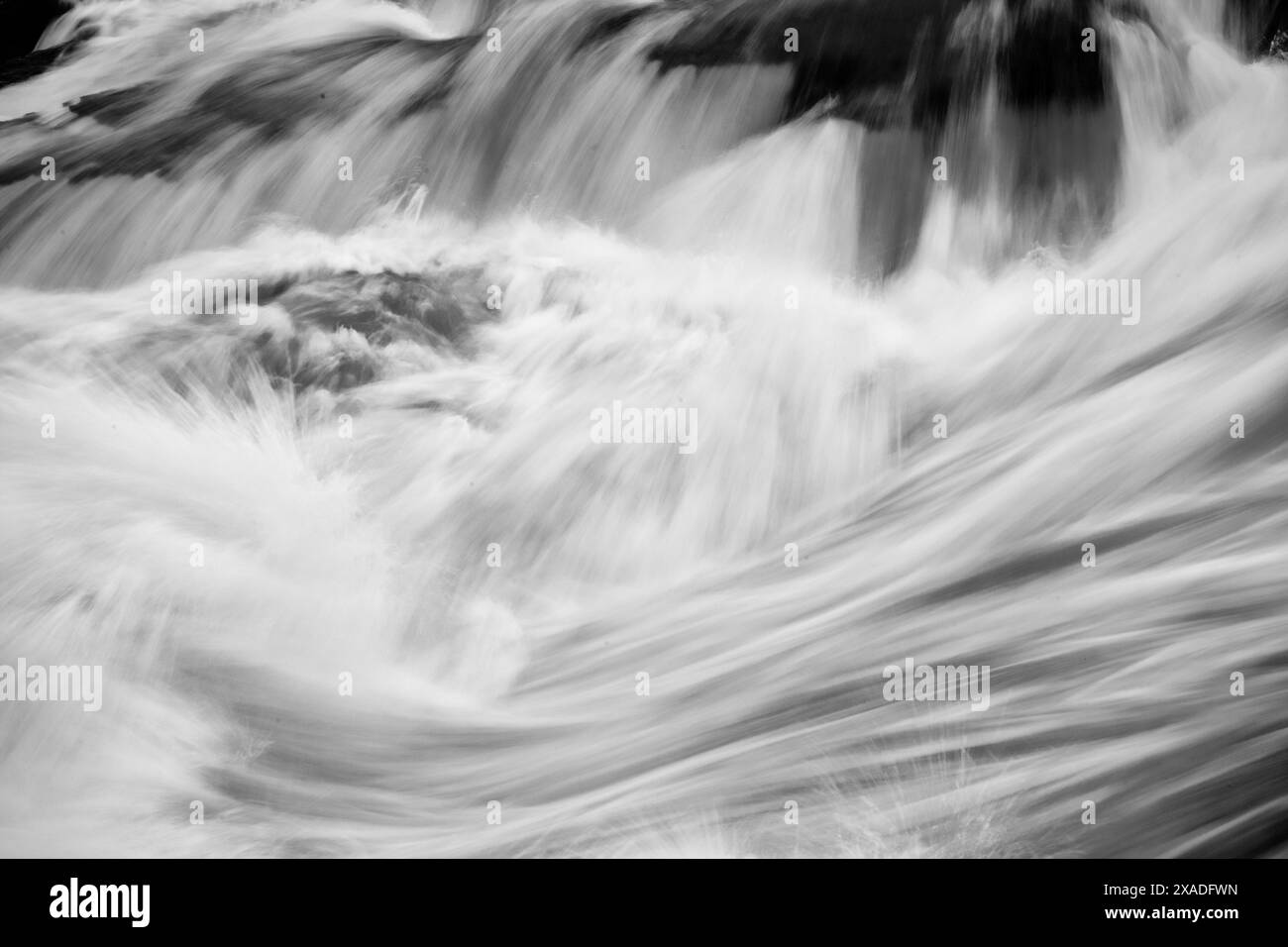 Abstract motion blur of water falling over rock formations at Great ...