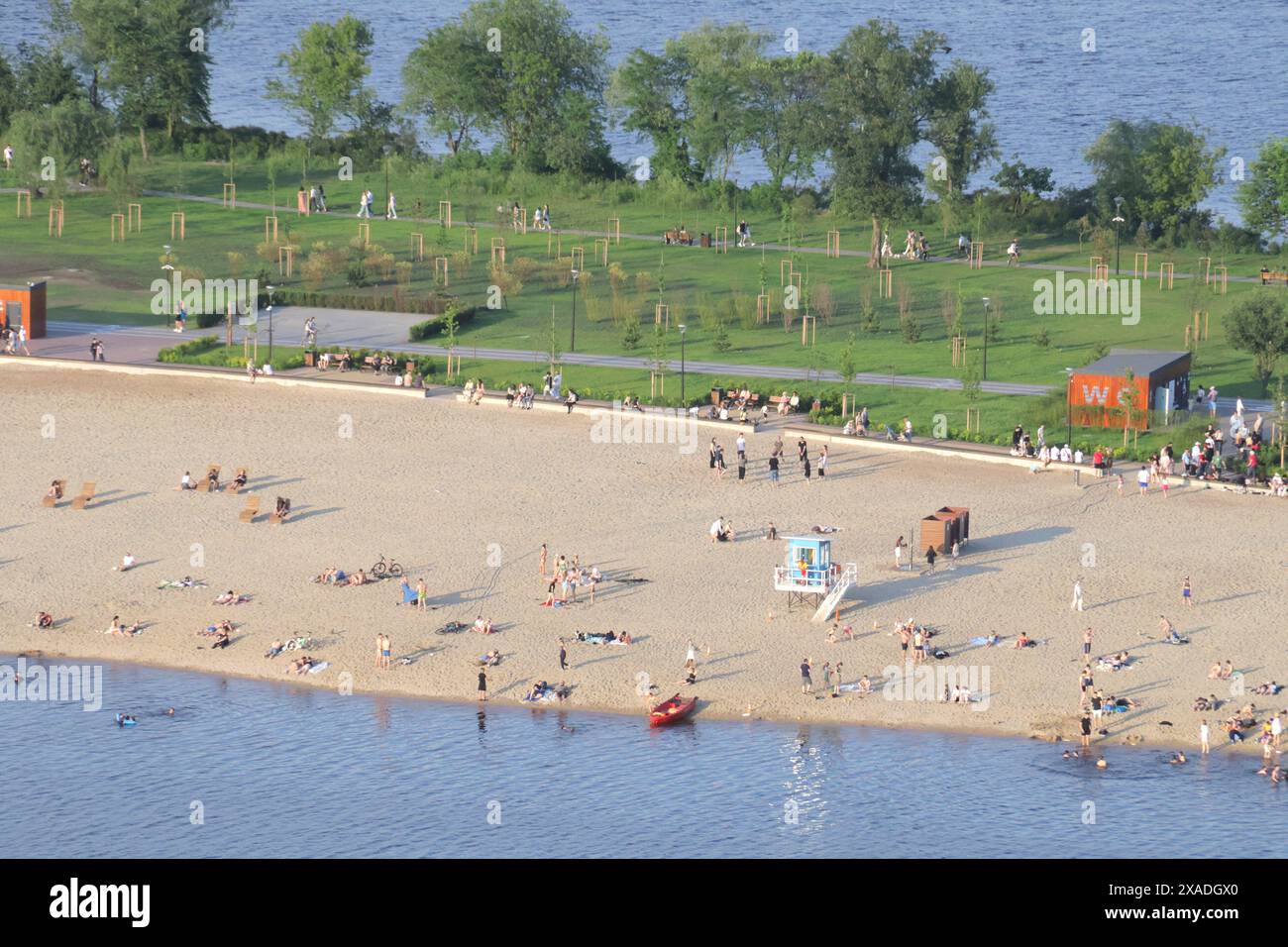 KYIV, UKRAINE - JUNE 1, 2024 - People relax on the beach on Obolonskyi ...
