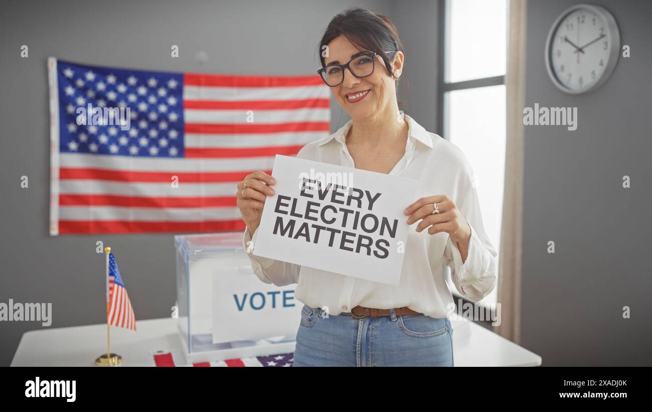 Smiling middle-aged woman holding a sign reading 'every election ...