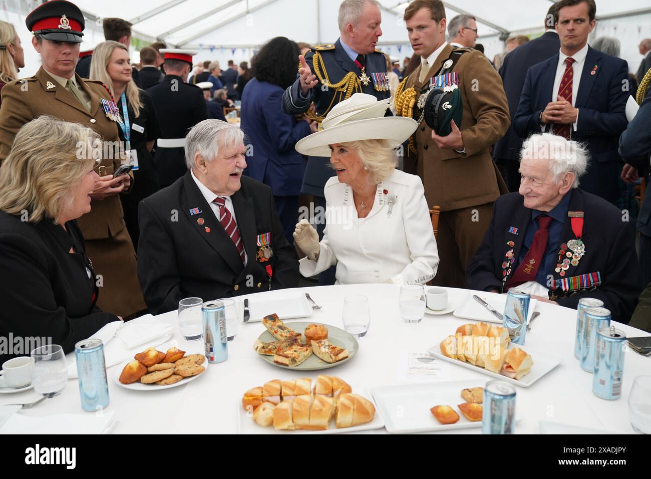 Queen Camilla speaks with veterans Arthur Oborne (left) and Albert Keir ...