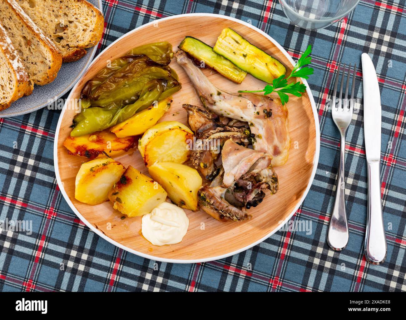 Roasted rabbit served with vegetable garnish Stock Photo - Alamy