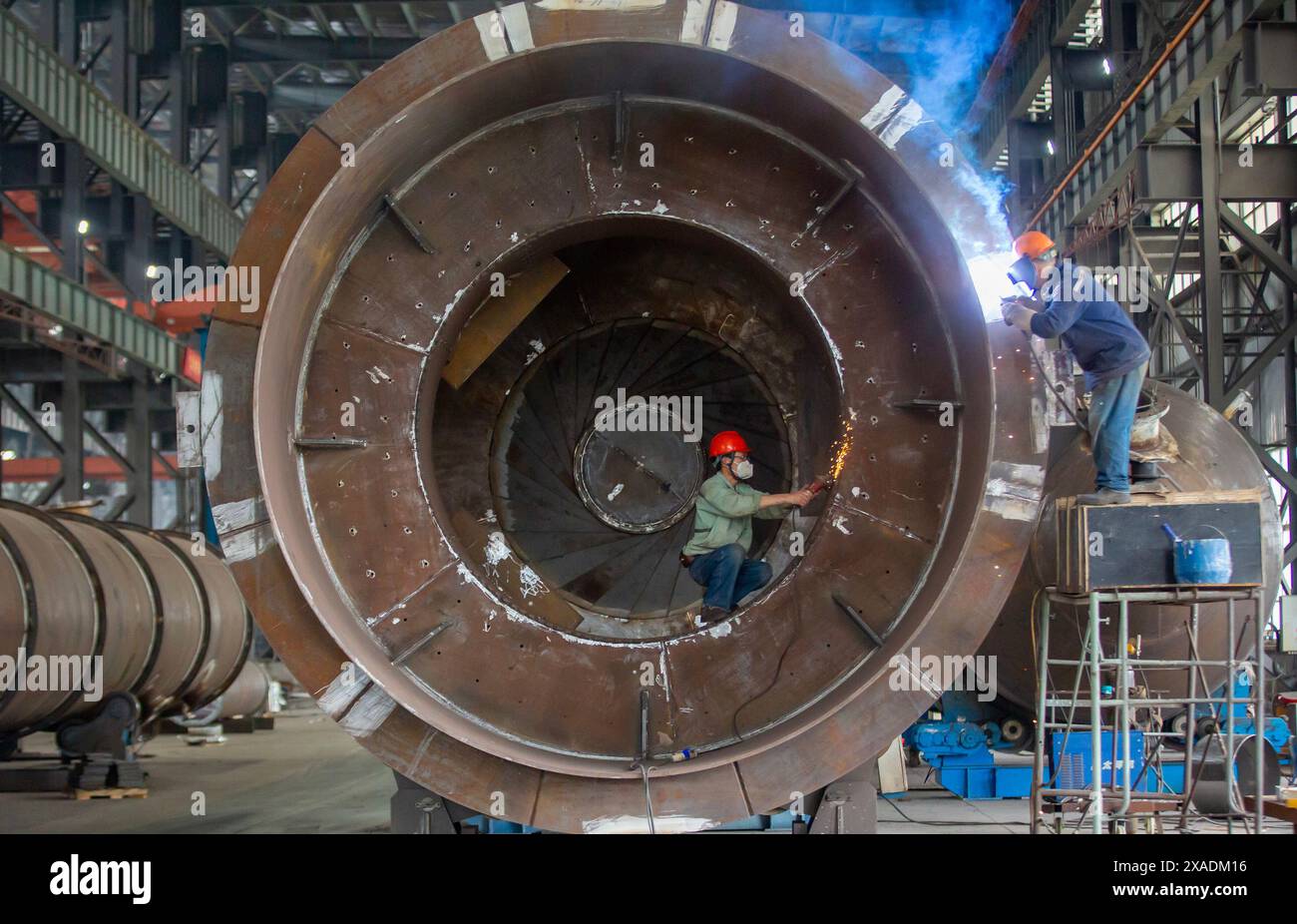 NANTONG, CHINA - JUNE 5, 2024 - A worker is producing various types of ...