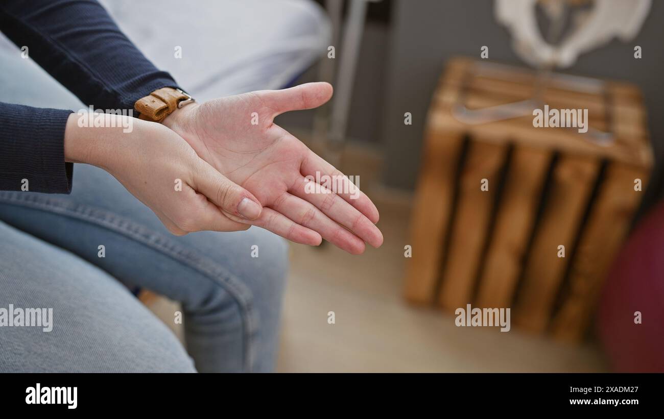 Close-up of a woman's extended hand ready for a handshake in an office ...