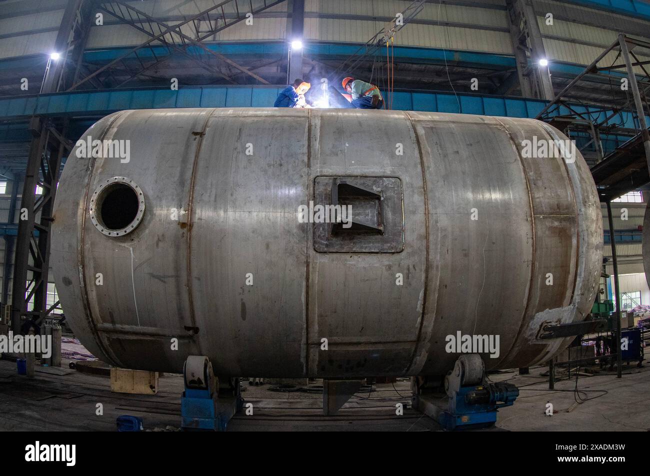 NANTONG, CHINA - JUNE 5, 2024 - A worker is producing various types of ...