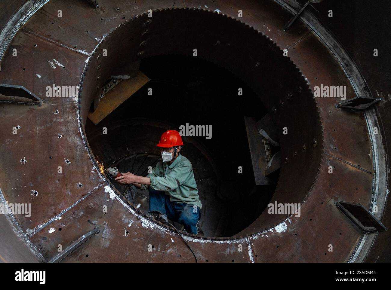 NANTONG, CHINA - JUNE 5, 2024 - A worker is producing various types of ...