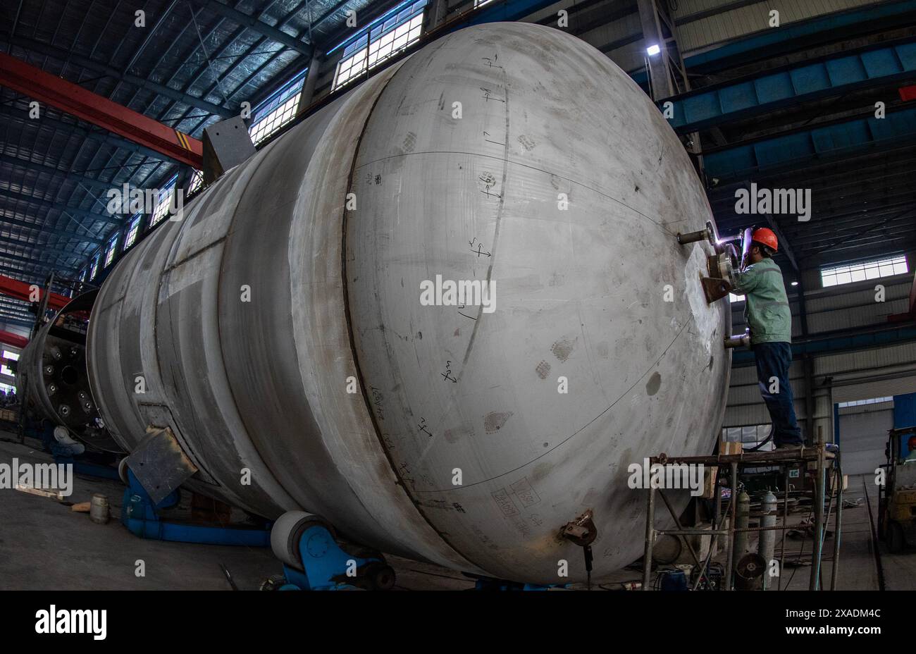 NANTONG, CHINA - JUNE 5, 2024 - A worker is producing various types of ...
