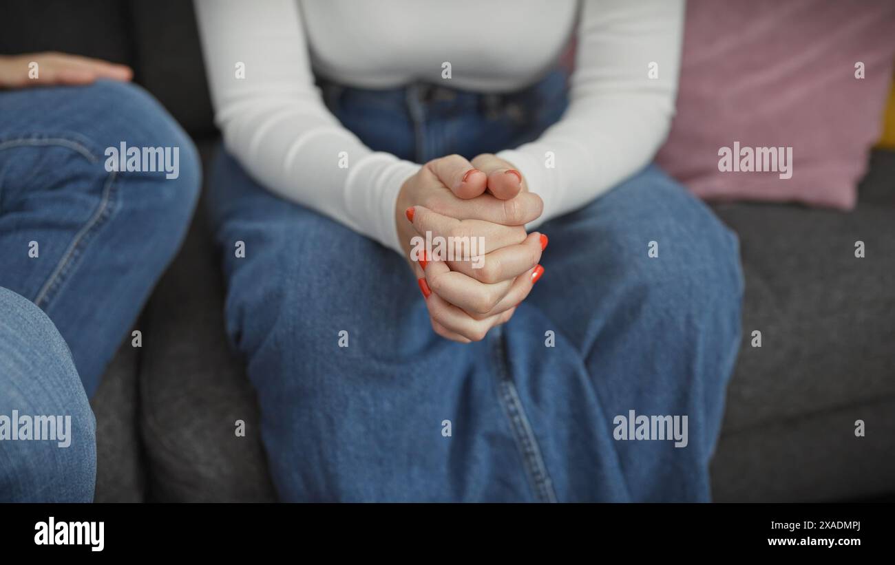 Couple sitting intertwined hi-res stock photography and images - Alamy