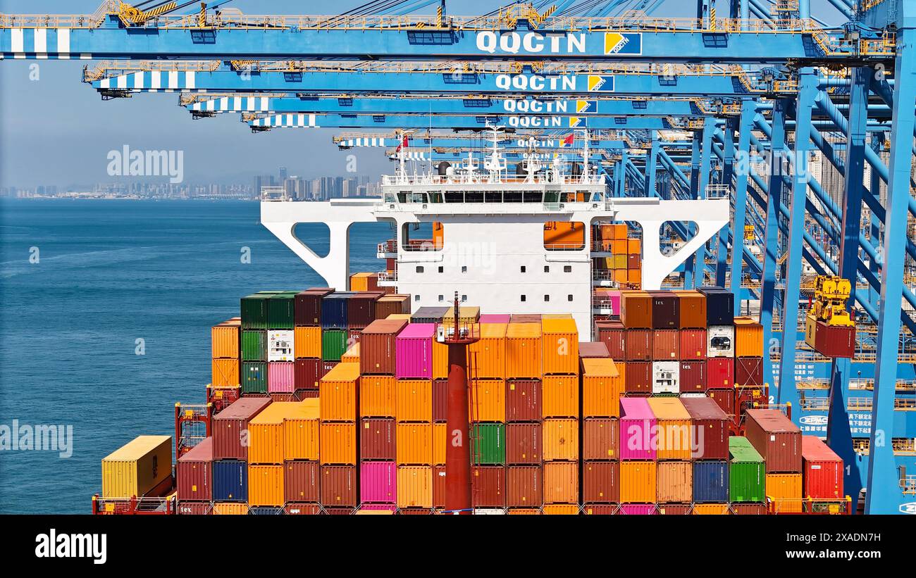 QINGDAO, CHINA - JUNE 6, 2024 - A cargo ship loads cargo at the fully ...