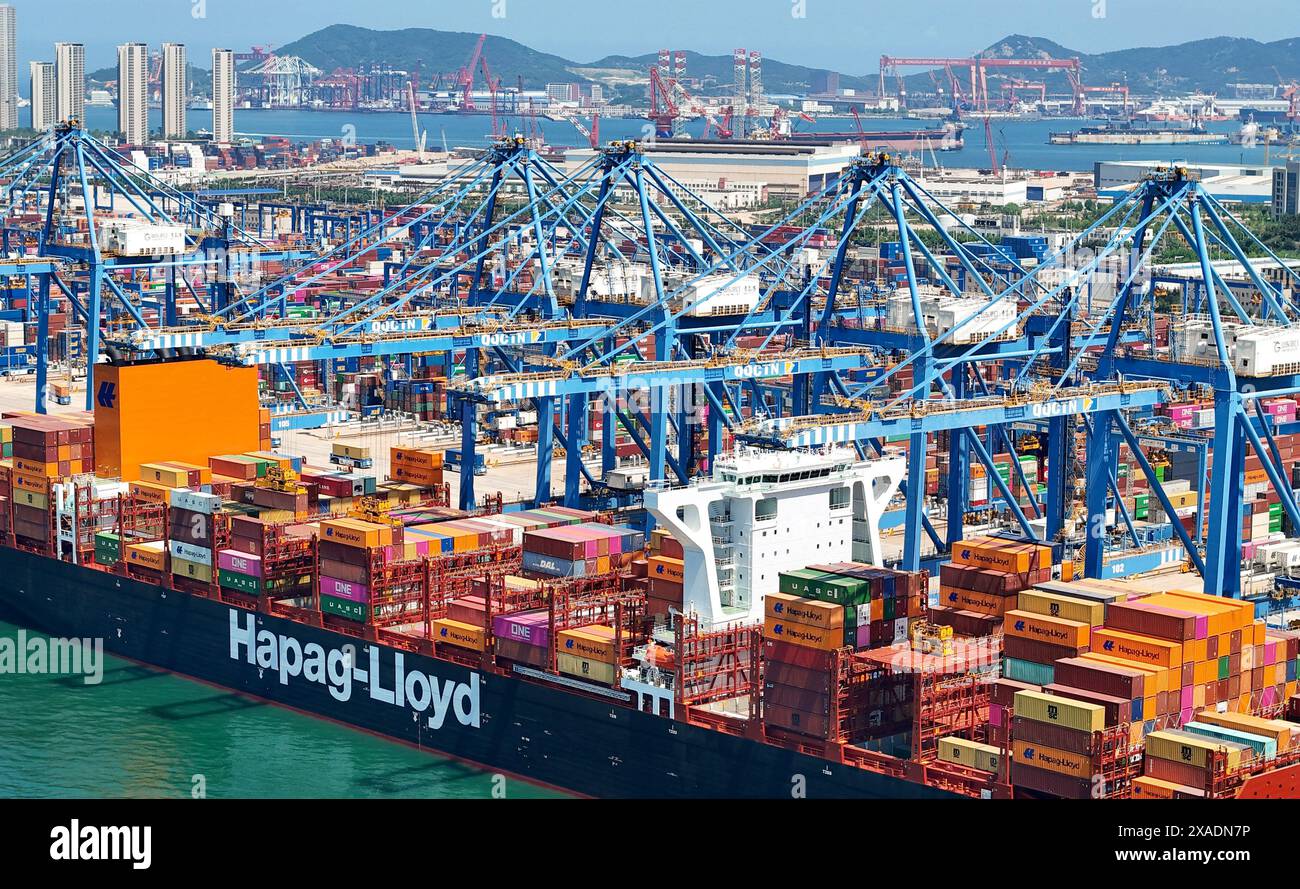 QINGDAO, CHINA - JUNE 6, 2024 - A cargo ship loads cargo at the fully ...