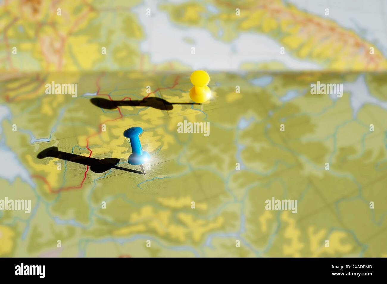 Yellow and blue pushpin showing the location of a destination point on ...