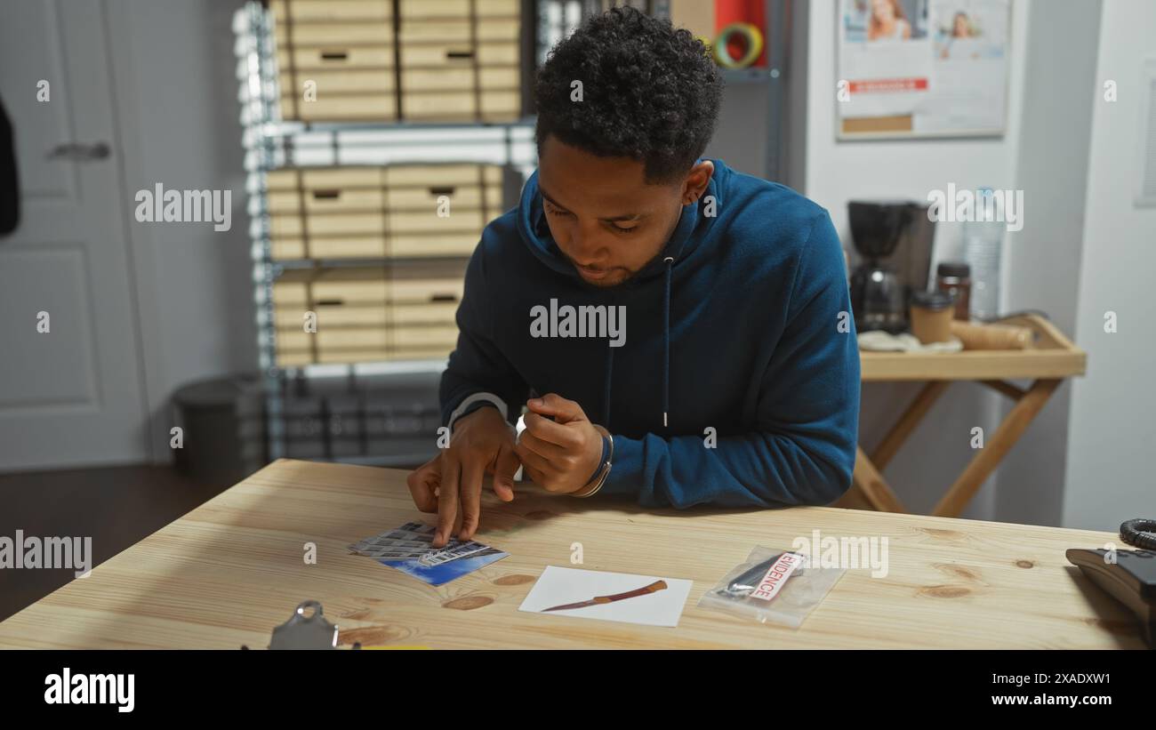 African american man examining evidence at police department's crime ...