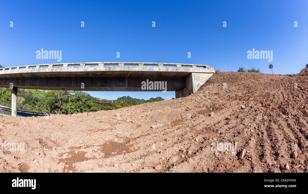 Construction industrial earthworks landscaping on highway bridge ramp ...