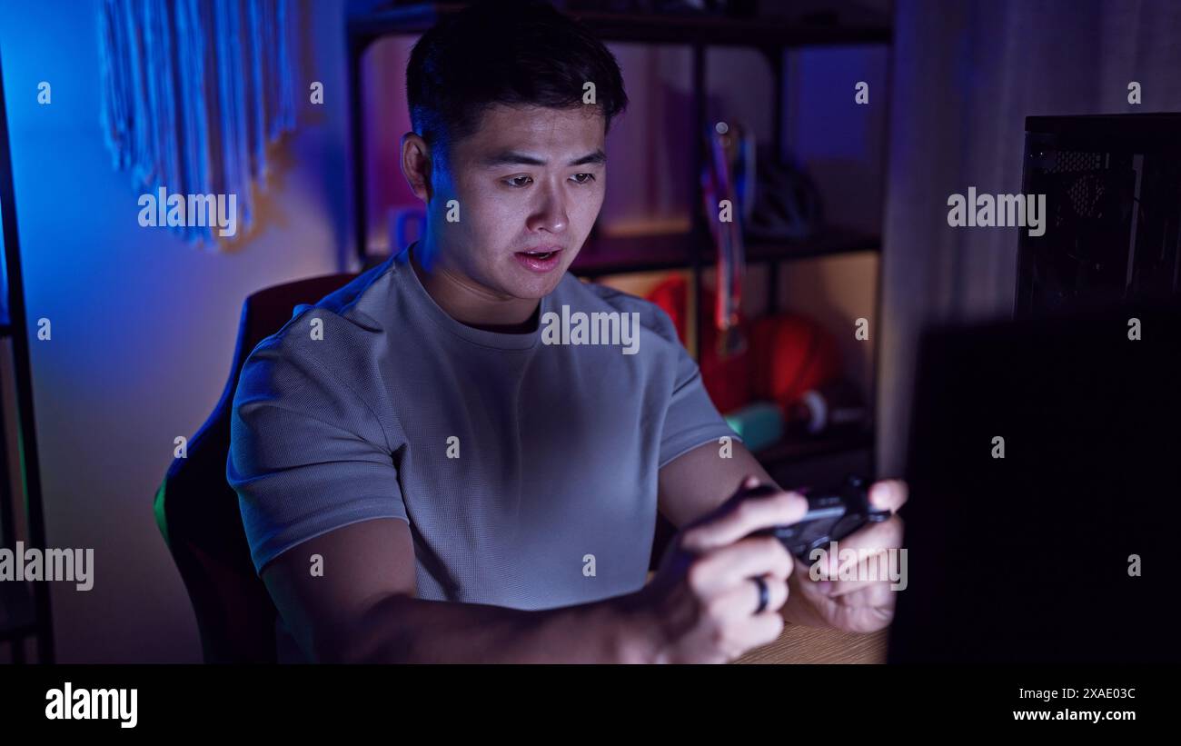 Asian male gamer sitting computer hi-res stock photography and images ...
