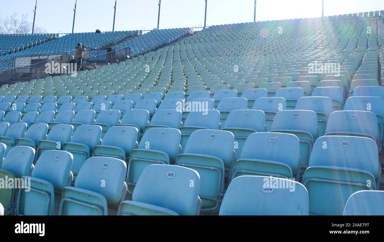 A stadium full of blue chairs with numbers on them Stock Photo - Alamy
