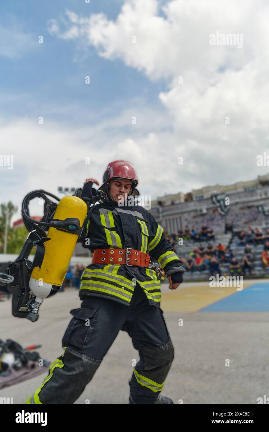 A firefighter dons the essential components of their professional gear ...