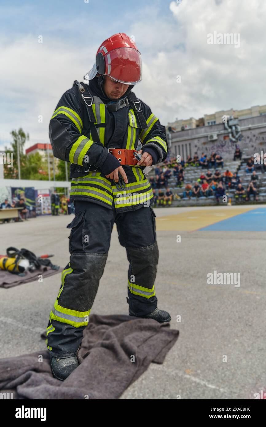 A firefighter dons the essential components of their professional gear ...