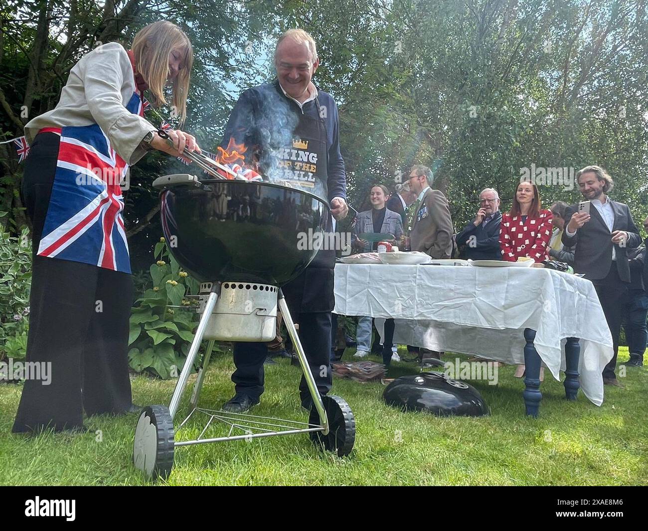 Liberal Democrats leader Sir Ed Davey, flipping burgers in a back ...