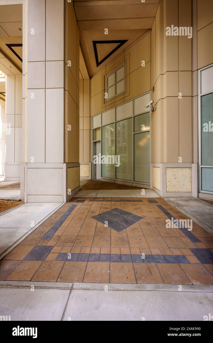 Generic office building exterior walkway. Vertical view of office or ...