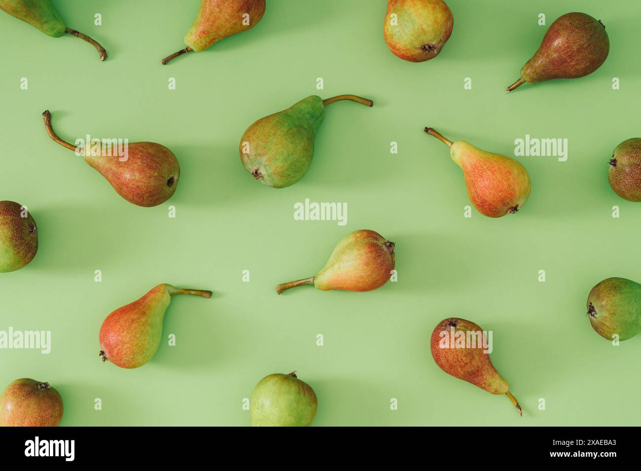 Trendy fruit pattern made of pears on pastel green background. Minimal ...