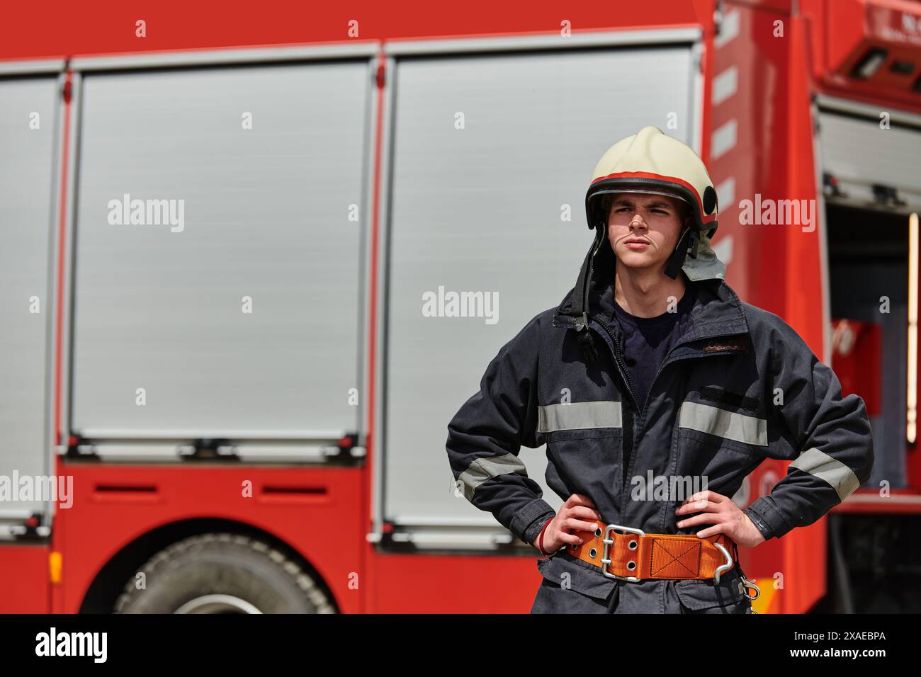 Firefighter Stands Proudly with Professional Gear Beside Fire Truck ...
