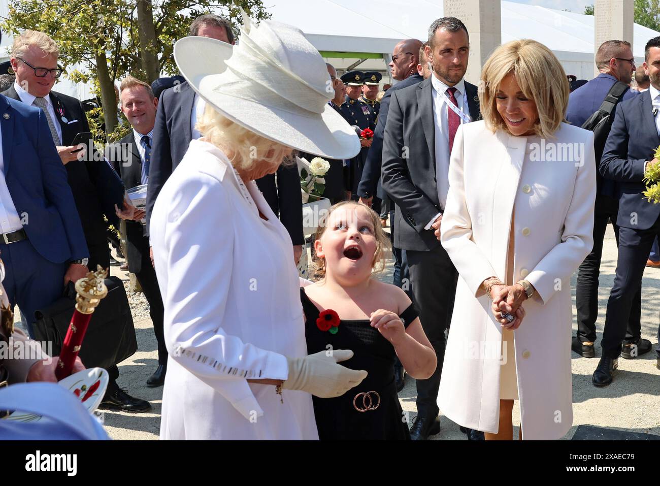 Queen Camilla is hugged by a young well-wisher following the UK ...