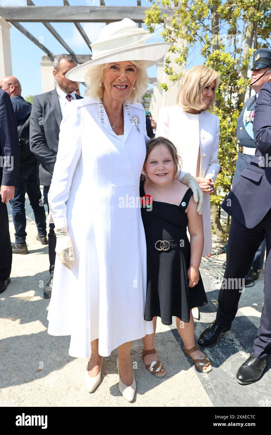 Queen Camilla is hugged by a young well-wisher following the UK ...