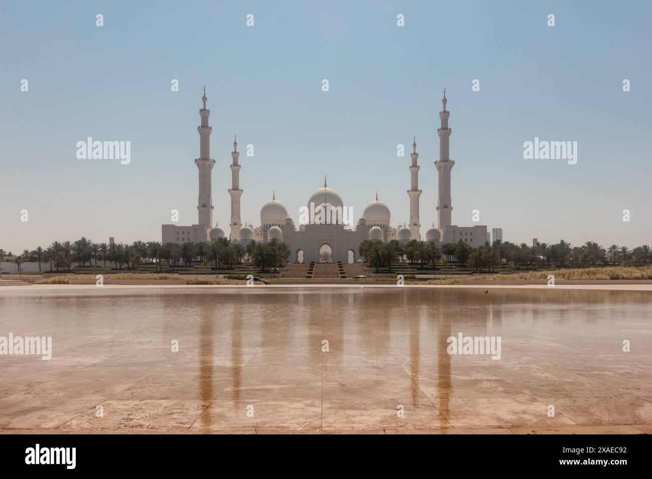 A view of Sheikh Zayed Grand Mosque reflected in the marble pool of ...