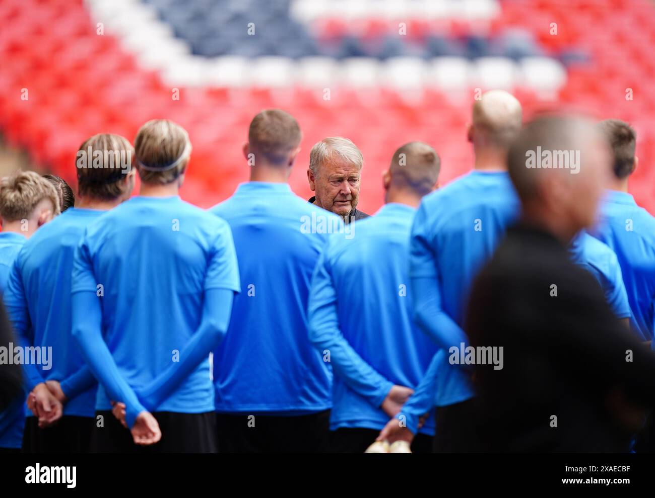 Iceland head coach Age Hareide instructs players during a training ...