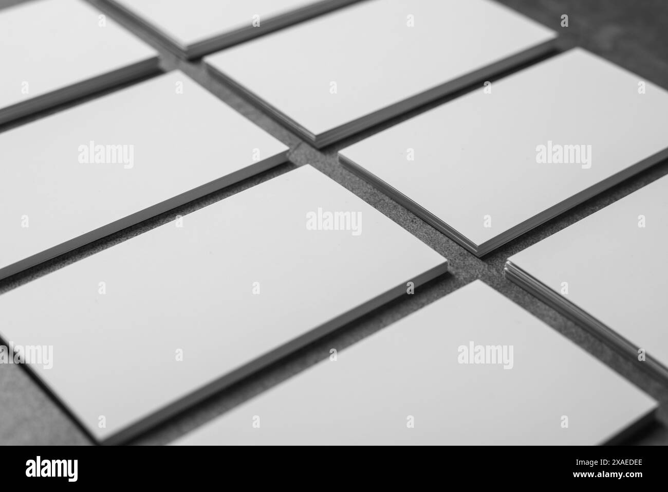 Blank business cards on grey textured table, closeup. Mockup for design ...
