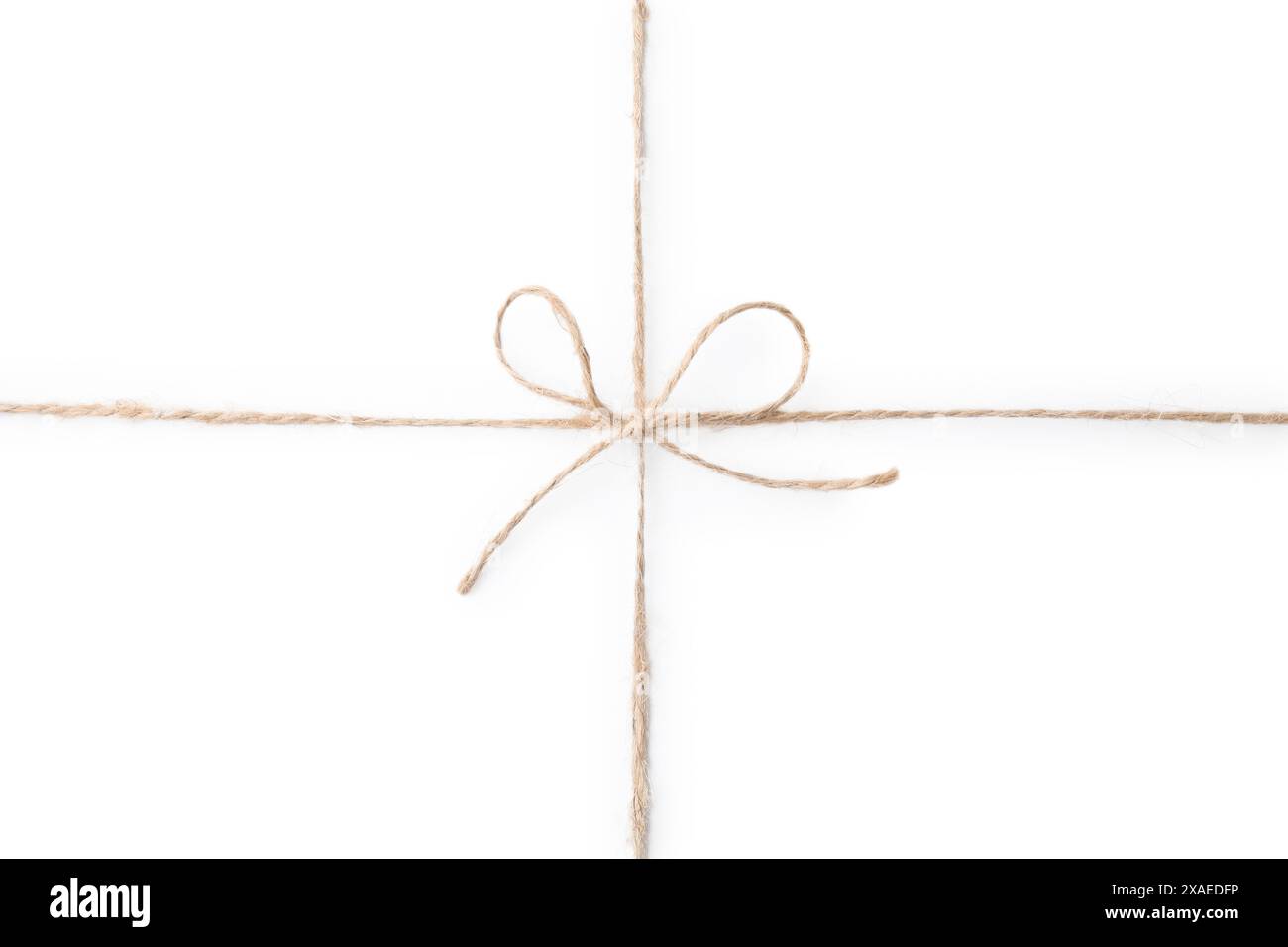 Linen rope string with bow isolated on white, top view Stock Photo - Alamy