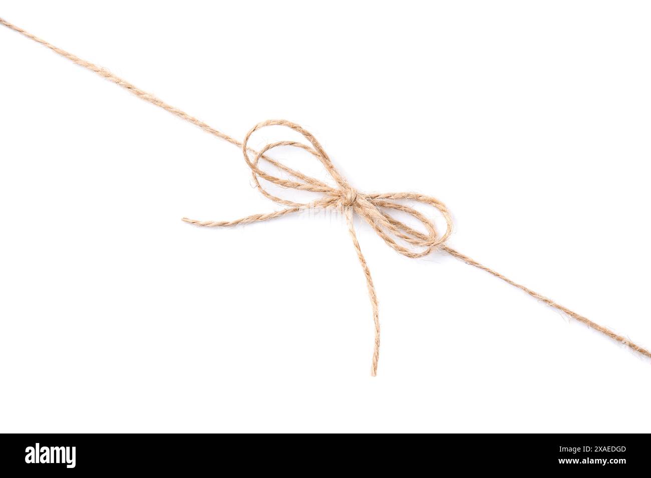 Linen rope string with bow isolated on white, top view Stock Photo - Alamy