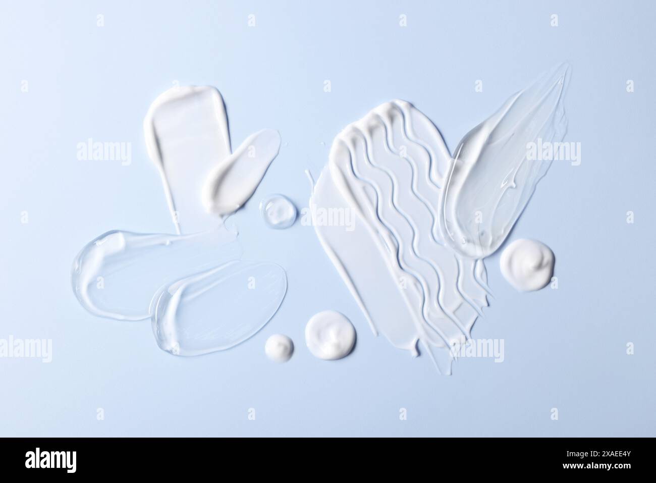 Samples of face cream on light blue background, top view Stock Photo ...
