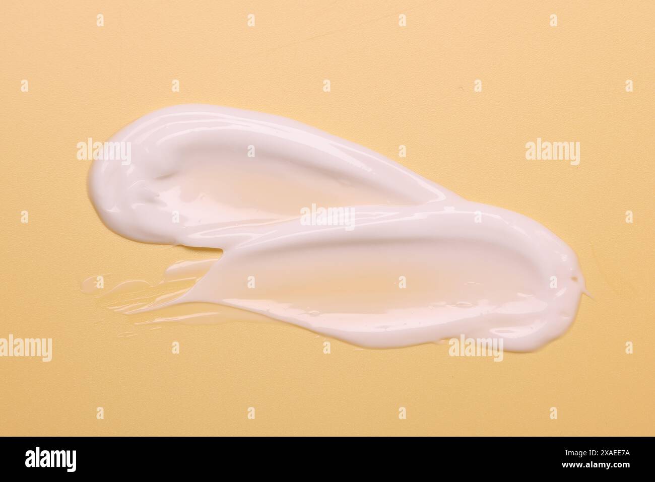 Samples of face cream on pale yellow background, top view Stock Photo ...