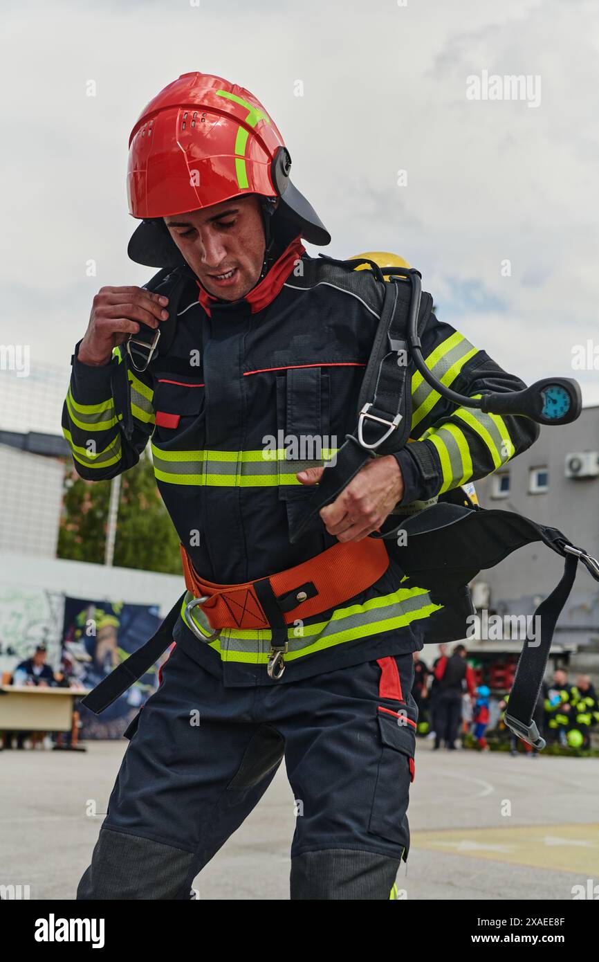 Professional Firefighter Suits Up in Full Gear for Duty Stock Photo - Alamy