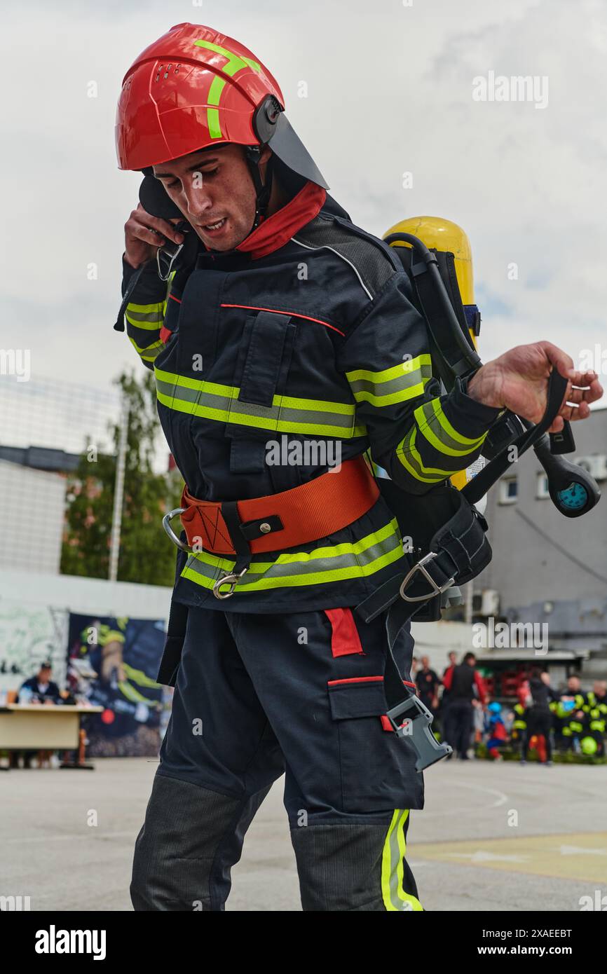 Professional Firefighter Suits Up in Full Gear for Duty Stock Photo - Alamy
