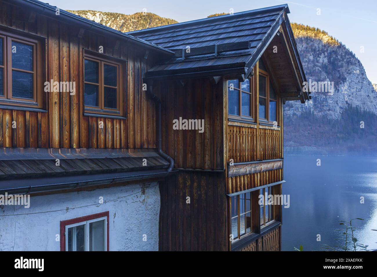 photography of a traditional wooden house on Alpine mountain lake of ...